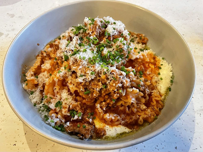 The legendary sausage ragu that launched a thousand return visits. Each bite delivers that perfect marriage of savory meat, tangy tomato, and perfectly al dente pasta.