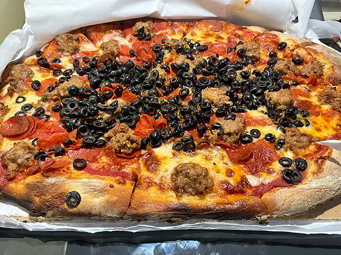 The sausage and black olive combo creates a beautiful chaos of flavors. Like a Jackson Pollock painting, but one you can devour with your hands.