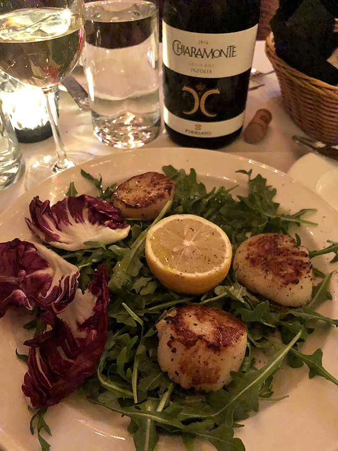 These scallops aren't just perfectly seared—they're transformative. The kind of dish that makes conversation stop and eyes close involuntarily.