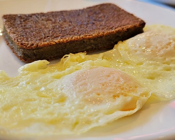 The perfect egg-scrapple-toast trinity that Delawareans dream about. That crispy-edged scrapple is the breakfast equivalent of finding a parking spot downtown.