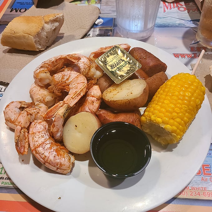 Gulf shrimp so perfectly cooked they practically snap to attention, accompanied by potatoes and corn that know their supporting role.