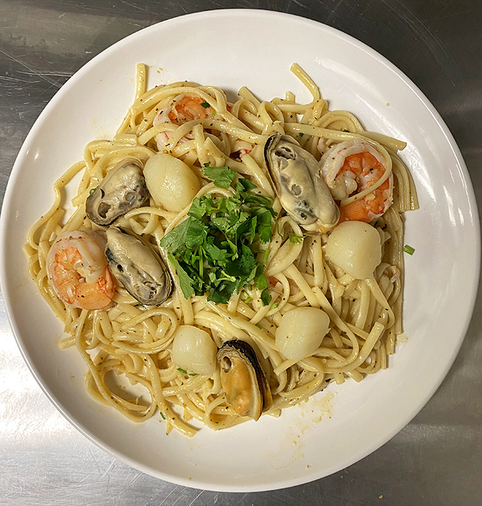 Seafood pasta that proves Toledo knows its way around both land and sea. Those mussels aren't just hanging out—they're elevating the entire dish.