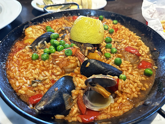 Paella that speaks Spanish with a California accent – mussels, shrimp, and saffron rice sharing stories in a single pan.