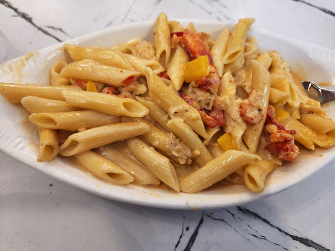 Pasta perfection! Al dente penne embraces chunks of seafood and bright bell peppers in a sauce that begs to be sopped up with bread.