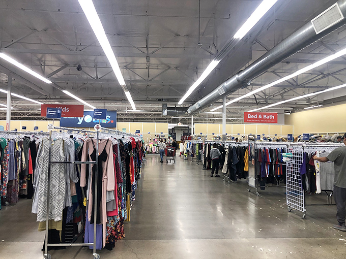 Fellow treasure hunters navigate the maze with shopping carts full of hopeful discoveries.