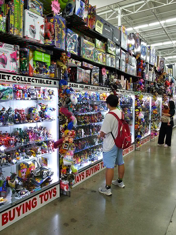 The modern treasure hunters in their natural habitat, scanning shelves with the focus of archaeologists discovering a new tomb.