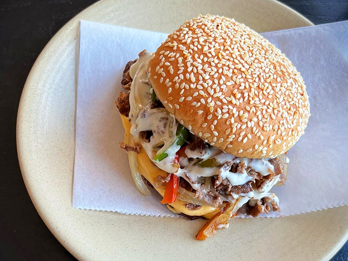 A burger that demands to be photographed before eaten, though your patience will be tested. The melty cheese cascade is practically hypnotic.