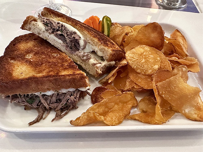 The short rib grilled cheese reveals its glorious cross-section&mdash;tender meat and melty cheese between perfectly golden bread. This isn't comfort food; it's a comfort revolution.