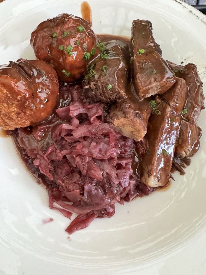 Sauerbraten with red cabbage—tender beef swimming in gravy so good you'll want to write home about it. Grandma's recipes have nothing on this.