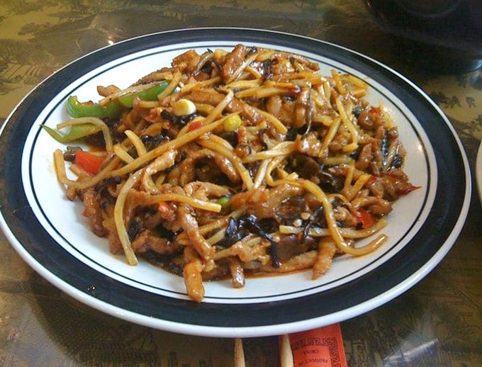 This stir-fried masterpiece showcases the beauty of balance—tender pork, crisp vegetables, and noodles that have soaked up all the right flavors.