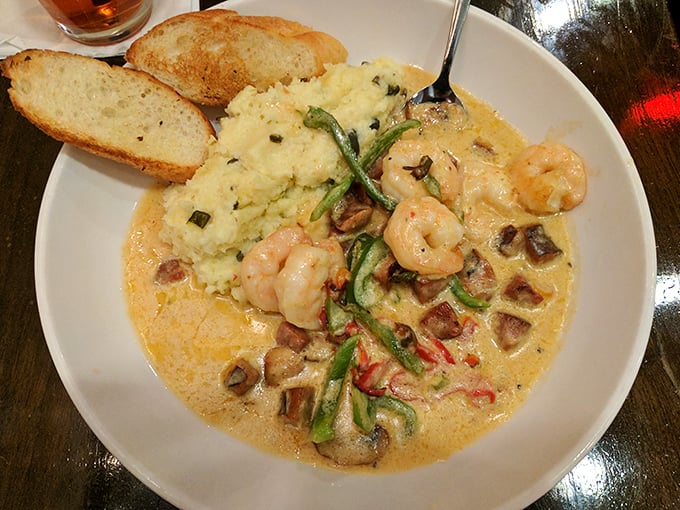 Shrimp and grits elevated to an art form. The creamy sauce creates a luxurious lagoon where plump shrimp and vegetables perform a delicious ballet.
