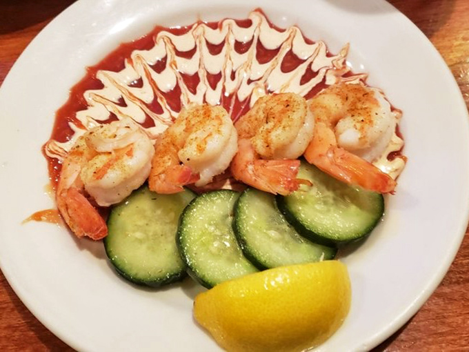Shrimp so perfectly cooked they practically pose for the camera. That artistic sauce swirl? Culinary jazz hands that actually deliver.
