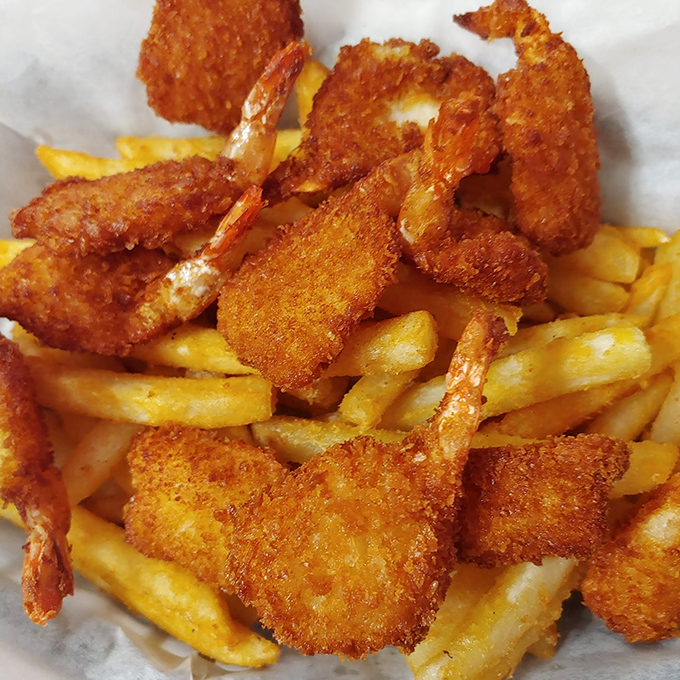Golden-fried shrimp perched atop a bed of crispy fries&mdash;a seafood and potato marriage that would make Neptune himself request seconds.