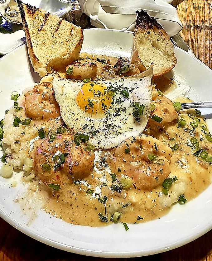Shrimp and grits with a sunny-side egg on top &ndash; because breakfast and dinner decided to have a delicious love child.