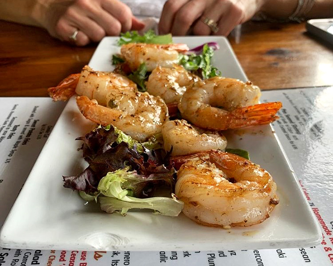 Perfectly seared shrimp that would make coastal restaurants jealous, served on a bed of greens that didn't just phone it in.