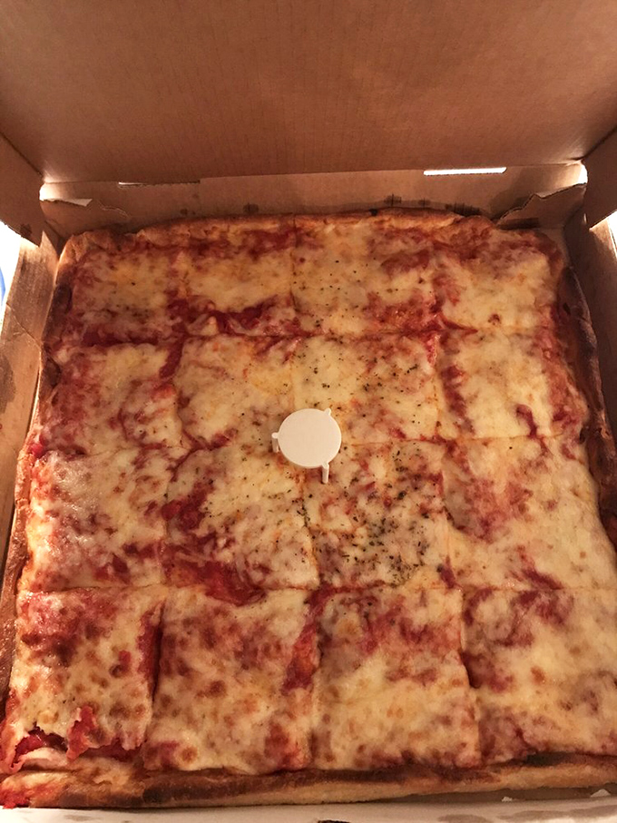 The Sicilian square pie&mdash;a canvas of cheese and sauce that proves sometimes the simplest combinations create the most profound experiences.