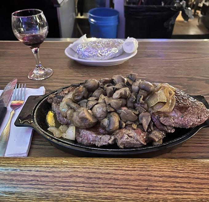 Steak and mushrooms, a romance as timeless as Bogart and Bacall. Sizzling on a cast iron skillet, this feast demands both knife and appetite.