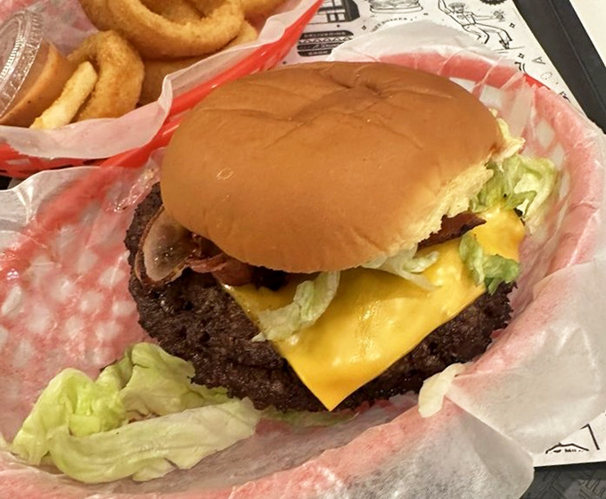 Behold the perfect smash burger&mdash;crispy-edged patty, melty American cheese, and fresh toppings nestled in a bun that knows its supporting role.
