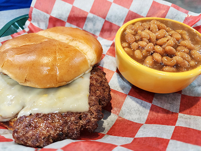 A burger that's achieved melty cheese perfection sits beside baked beans that would make your grandmother nod in approval. Comfort food's greatest hits album.