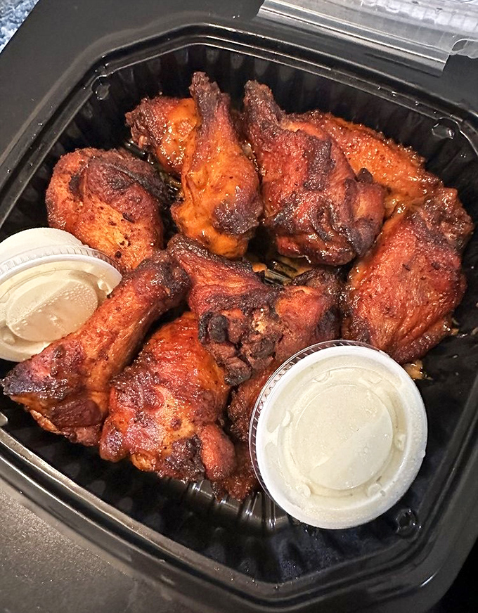 Smoked wings that make Buffalo weep with jealousy, their burnished skin hiding meat so tender it practically high-fives your taste buds.