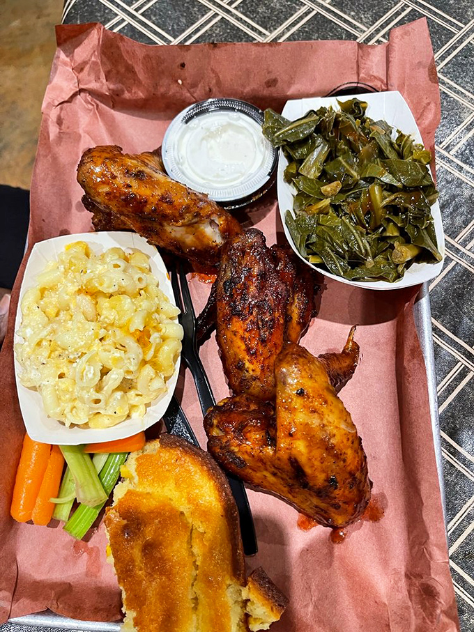 A BBQ plate that hits all the right notes – smoky chicken, creamy mac and cheese, tender greens, and cornbread that would make your grandma jealous.