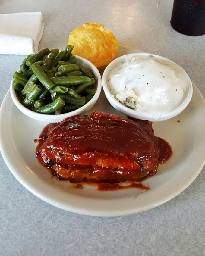 The legendary smoked meatloaf, glazed to perfection and flanked by green beans and mashed potatoes. Comfort food's highest achievement unlocked.