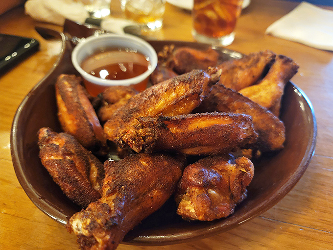 Wings that have clearly graduated from flying school to smoking class with honors. That sauce cup is just waiting for its diving moment.