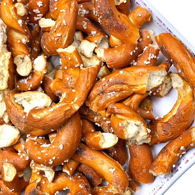 These aren't your ballpark pretzels; they're golden, twisted masterpieces that redefine the snack game entirely.