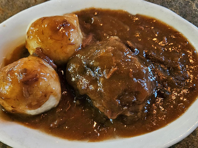 Comfort food royalty: tender beef swimming in rich gravy alongside perfectly formed dumplings. Grandma would approve&mdash;and ask for seconds.
