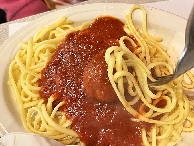 Spaghetti that makes you understand why Lady and the Tramp risked public embarrassment. That sauce isn't just red&mdash;it's a sunset in Tuscany.