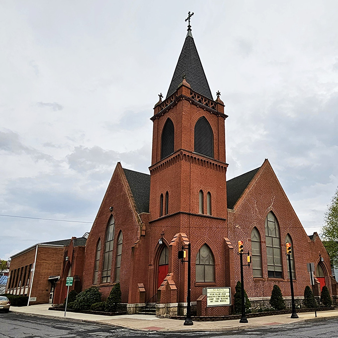 The brick church stands as a testament to community values, its steeple reaching skyward like the town's affordable housing market &ndash; a blessing indeed.