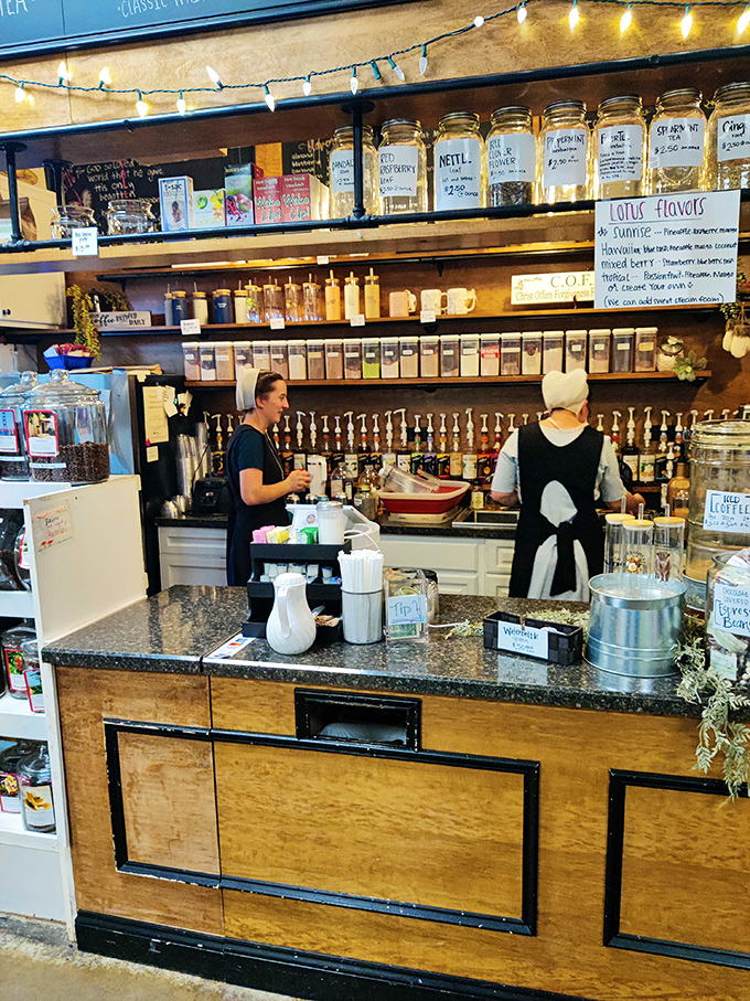 Behind this rustic wooden counter, Amish vendors serve up herbal teas and homemade remedies. The wall of glass jars holds nature's pharmacy.