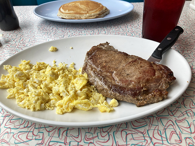 Steak and eggs: the breakfast of champions, philosophers, and anyone who believes lunch rules are meant to be broken. Simple perfection on a white plate.