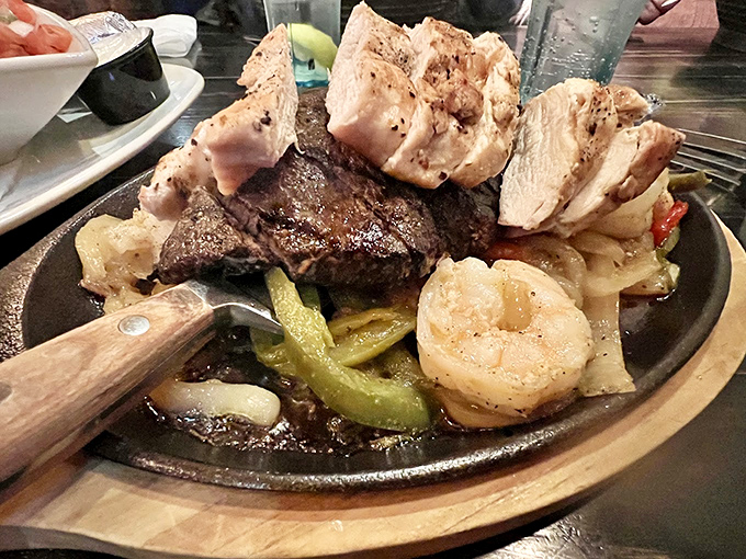 Surf and turf and cluck? This sizzling fajita trio doesn't just break the rules, it rewrites the delicious rulebook entirely.