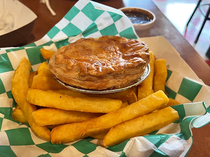 A proper savory pie surrounded by golden chips&mdash;the kind of hearty meal that makes you want to cheer for a team you've never heard of.