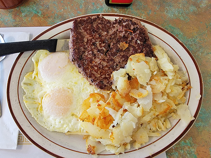 Breakfast of champions: a hearty steak with eggs sunny-side up and home fries that could convert a sworn breakfast-skipper into a morning person.