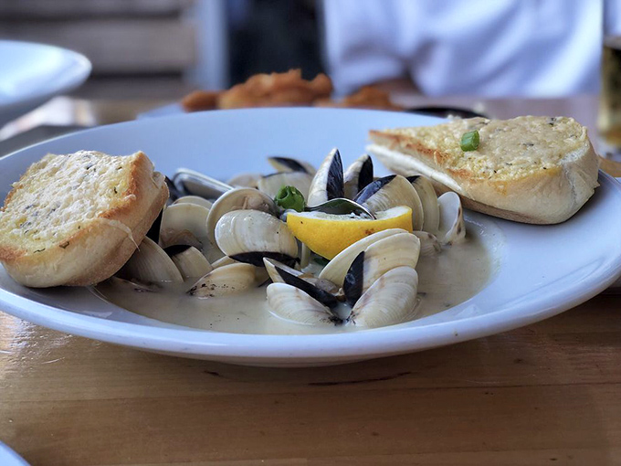 These steamed clams swimming in buttery broth with toasted garlic bread for dipping are basically an excuse to drink butter in public.