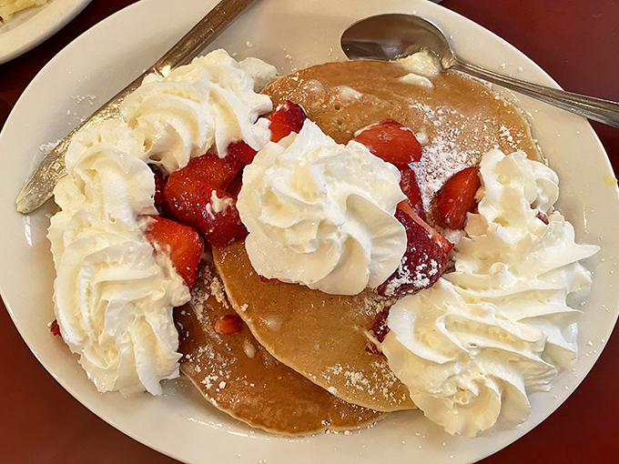 These pancakes don't just have strawberries&mdash;they've formed a delicious alliance. The whipped cream ambassadors are negotiating peace between your taste buds and diet.