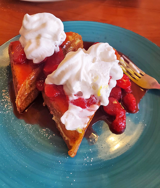 Strawberry-topped French toast that makes you question whether you're having breakfast or dessert. The correct answer is: who cares?
