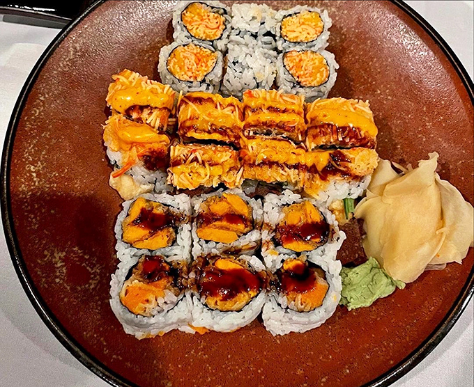 Sushi that's as colorful as it is inviting. Those bright orange toppings aren't just garnish—they're promises of flavor waiting to be discovered.
