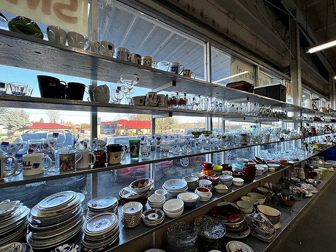 These shelves of glassware and dishes tell stories of dinner parties past, each piece waiting for its second act in a new home.