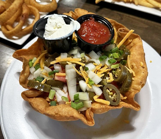 Taco salad that breaks free from its tortilla prison. This colorful rebellion of fresh ingredients, cheese, and jalape&ntilde;os is ready for your fork's freedom march. 