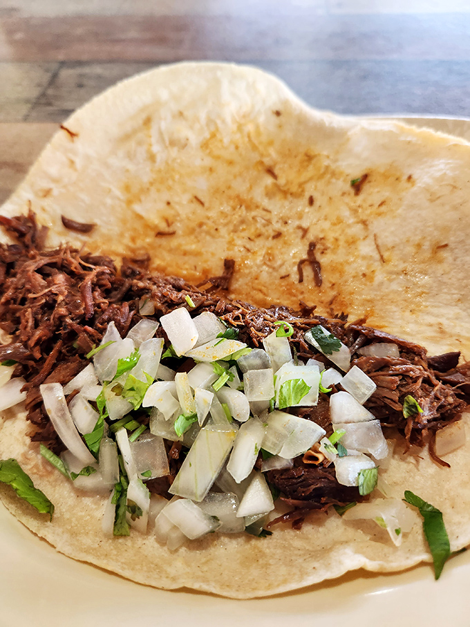 These carnitas tacos showcase perfectly seasoned pork that's so tender, it practically melts before you even take a bite. 