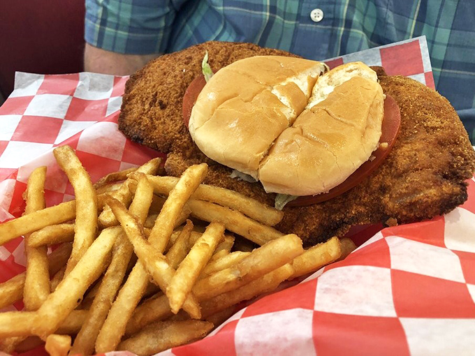 This isn't just a tenderloin sandwich; it's edible architecture&mdash;a crispy-coated masterpiece that laughs in the face of your diet plans and wins every time.