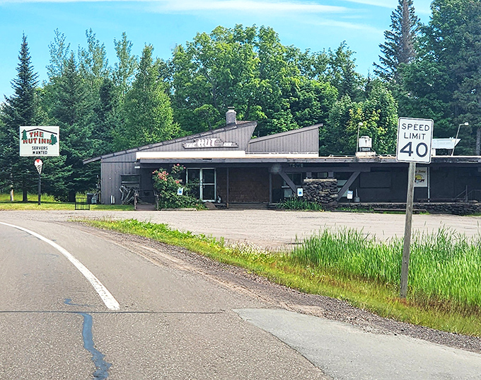 The Hut Restaurant sits like a humble time capsule along the highway, where speed limits are suggestions and comfort food is serious business.