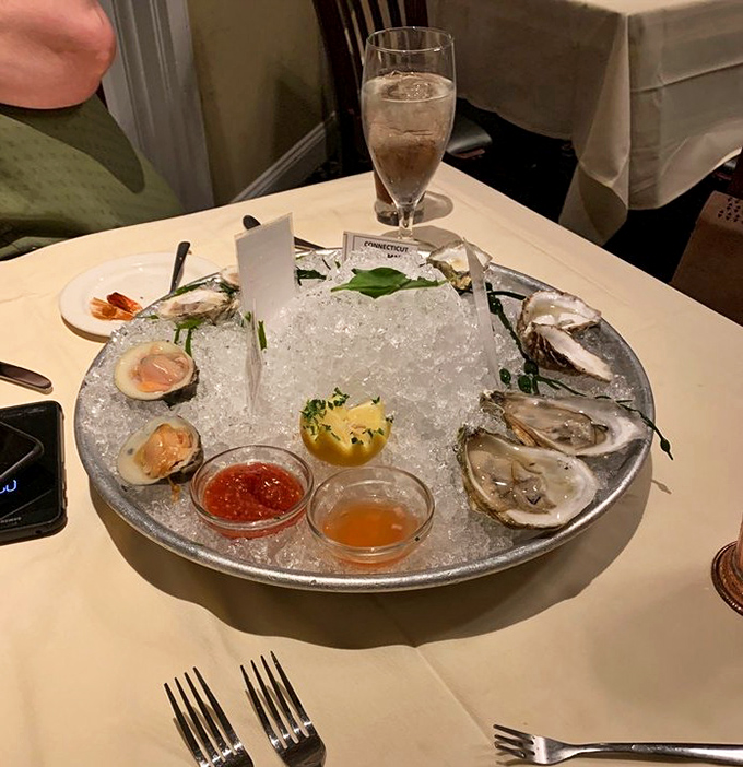 The seafood tower arrives like Neptune's personal offering&mdash;briny oysters nestled on ice, waiting for just a squeeze of lemon.