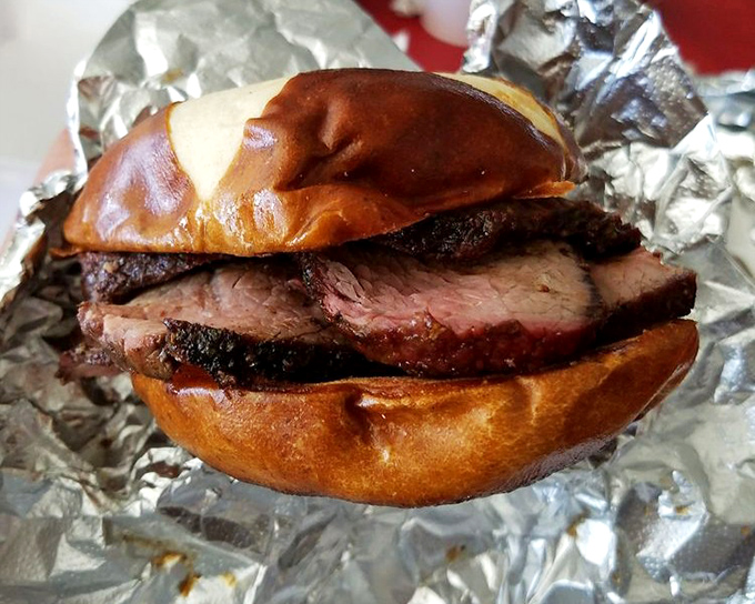 The tri-tip sandwich isn't messing around. That glossy bun cradles slices of pink-centered beef with the tenderness of a love letter to meat.