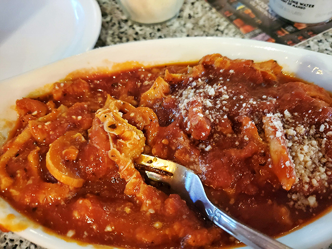 The tripe, swimming in rich tomato sauce and dusted with cheese, represents a culinary tradition that's increasingly rare but fiercely defended by those in the know.