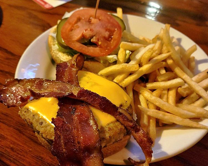The Flying Pig burger comes with crispy bacon that would make even vegetarians consider a momentary lapse in principles. Paired with golden fries, it's Cincinnati on a plate.