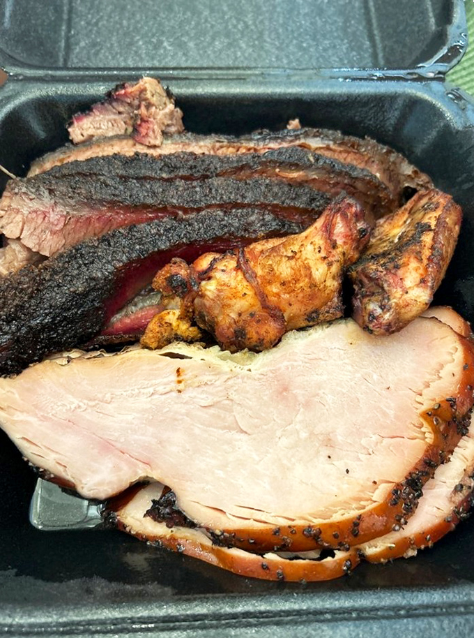 The holy trinity of barbecue: brisket with its mahogany crust, turkey maintaining impossible juiciness, and wings that didn't fly south for better treatment.